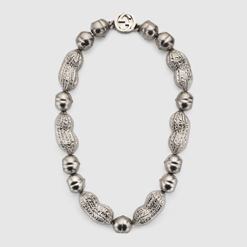สร้อยคอ Interlocking G necklace with hazelnut and peanut charms inโลหะ ...
