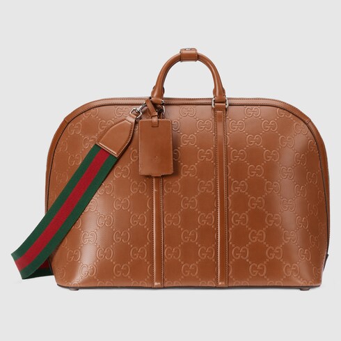GG embossed large duffle bag in Brown Leather | GUCCI® SI