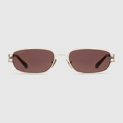 Sonnenbrille mit rechteckigem Rahmen in goldfarben | GUCCI® DE