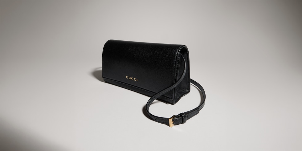 Mini pouch with Gucci lettering in black leather | GUCCI® US