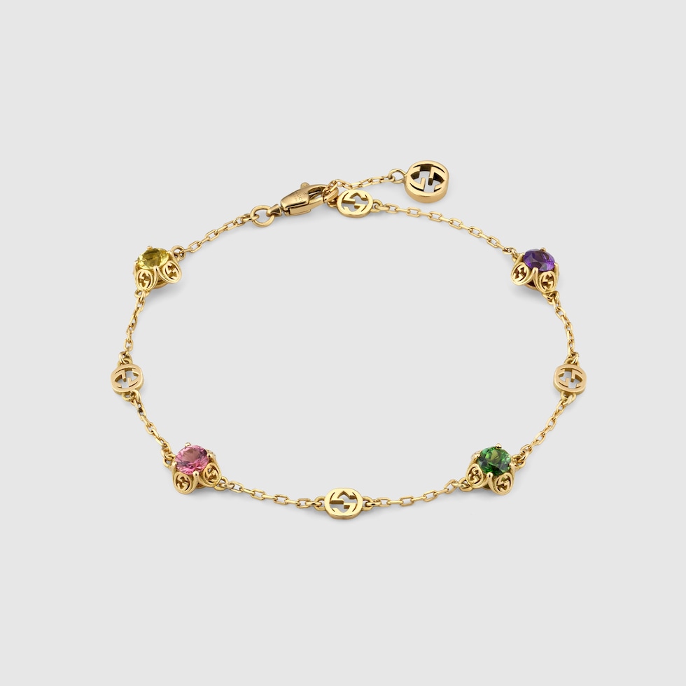 Interlocking G bracelet with gemstones in 18k yellow gold | GUCCI® SE