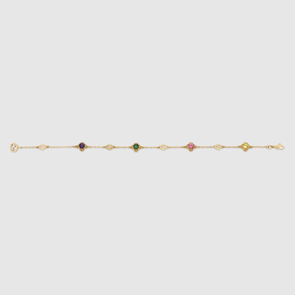 Interlocking G bracelet with gemstones in 18k yellow gold | GUCCI® SE