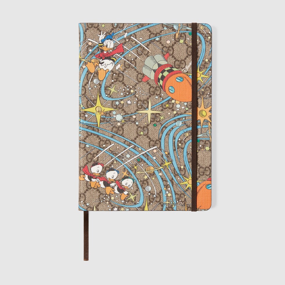 Disney x Gucci large Donald Duck notebook in beige and ebony GG Supreme ...