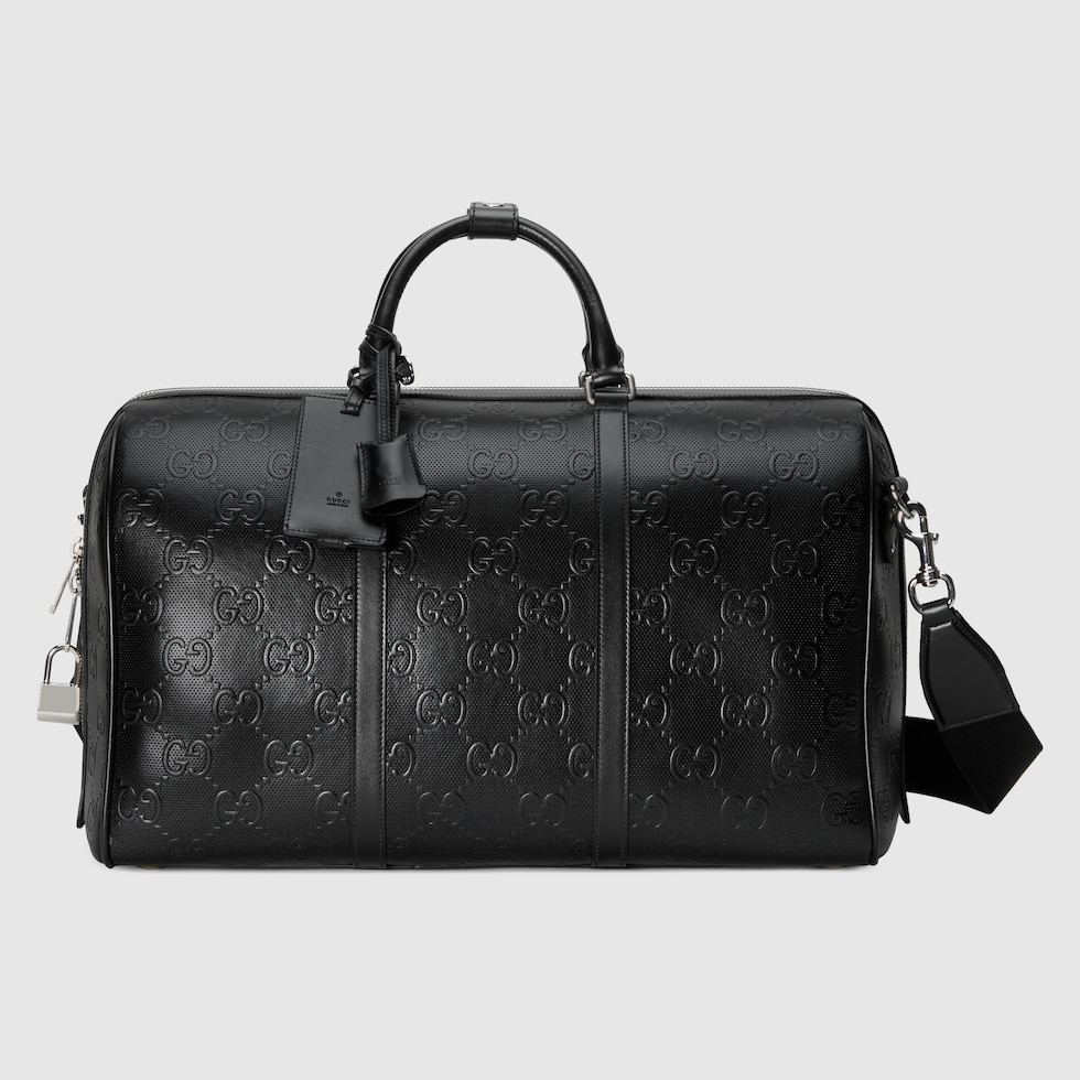 GG embossed duffle bag in black leather | GUCCI® Canada