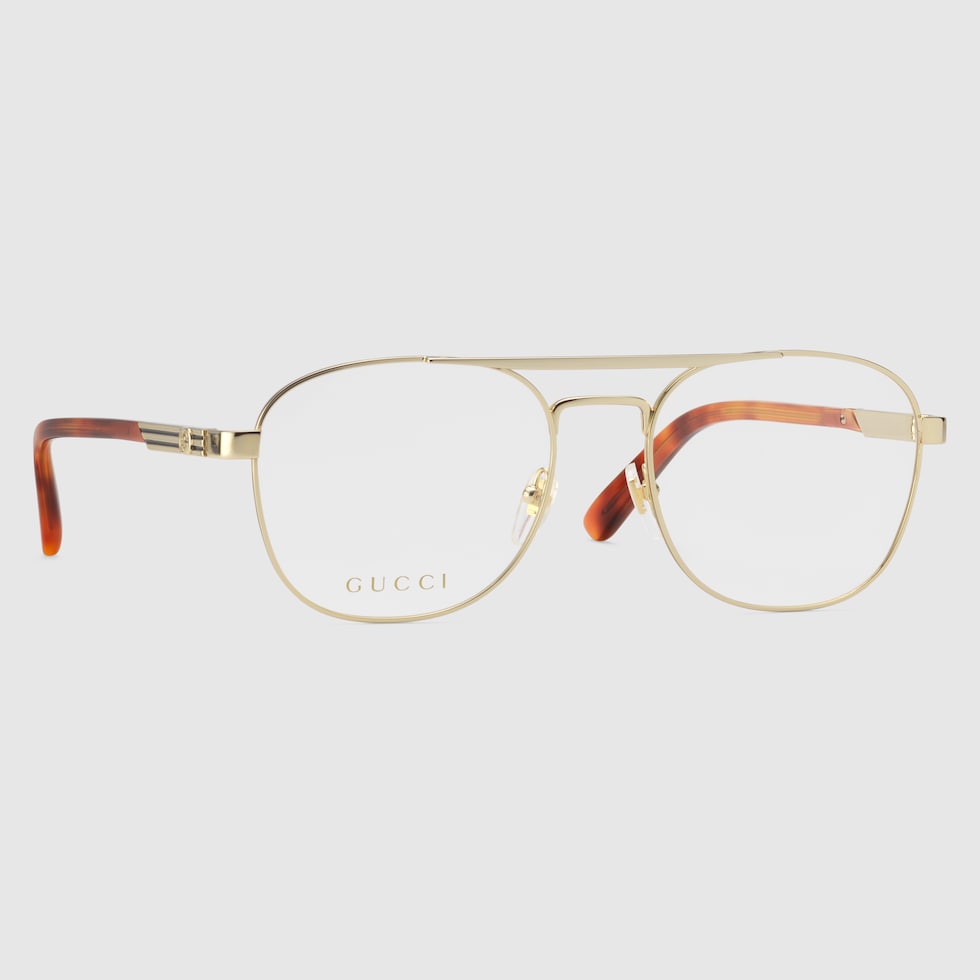 Round optical frame in gold-toned metal | GUCCI® DK