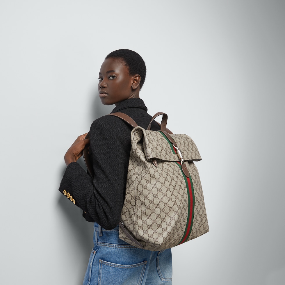 GG backpack with piston closure in beige and ebony GG Supreme | GUCCI® SG