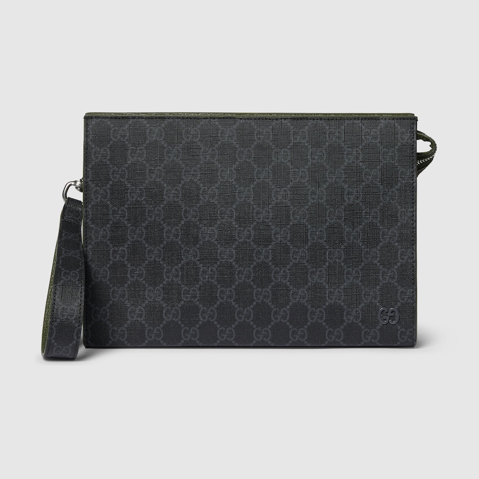 GG pouch with dark green trim in black GG Supreme canvas | GUCCI® SG