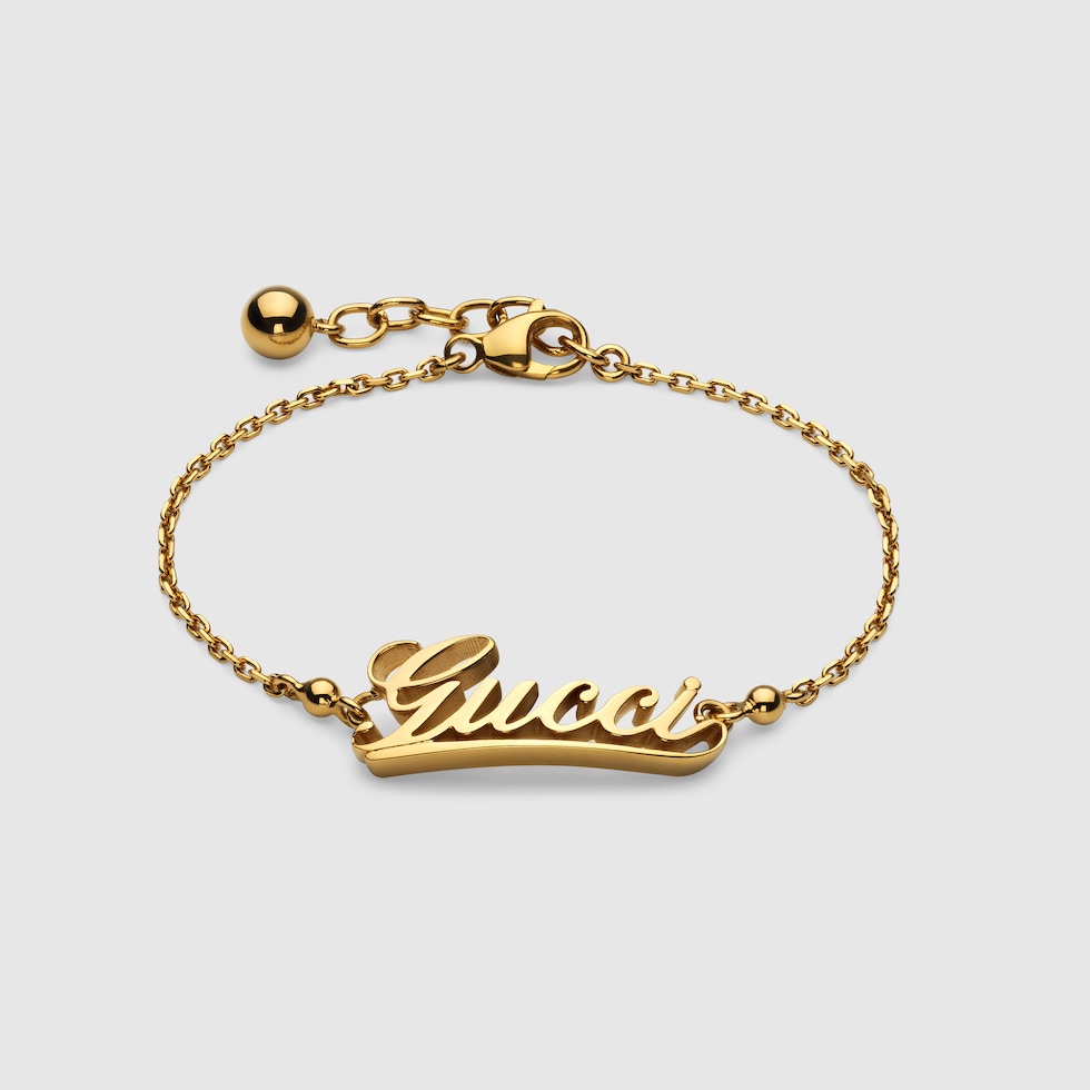 Chain bracelet with Gucci script in yellow gold-toned metal | GUCCI® US