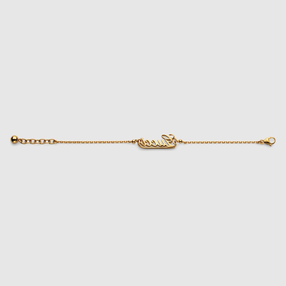 Chain bracelet with Gucci script in yellow gold-toned metal | GUCCI® US
