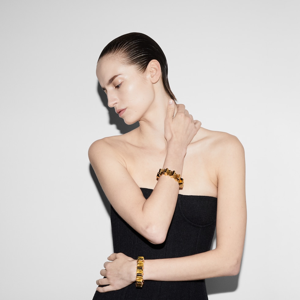 Bracelet with geometric studs in yellow gold-toned metal | GUCCI® PT
