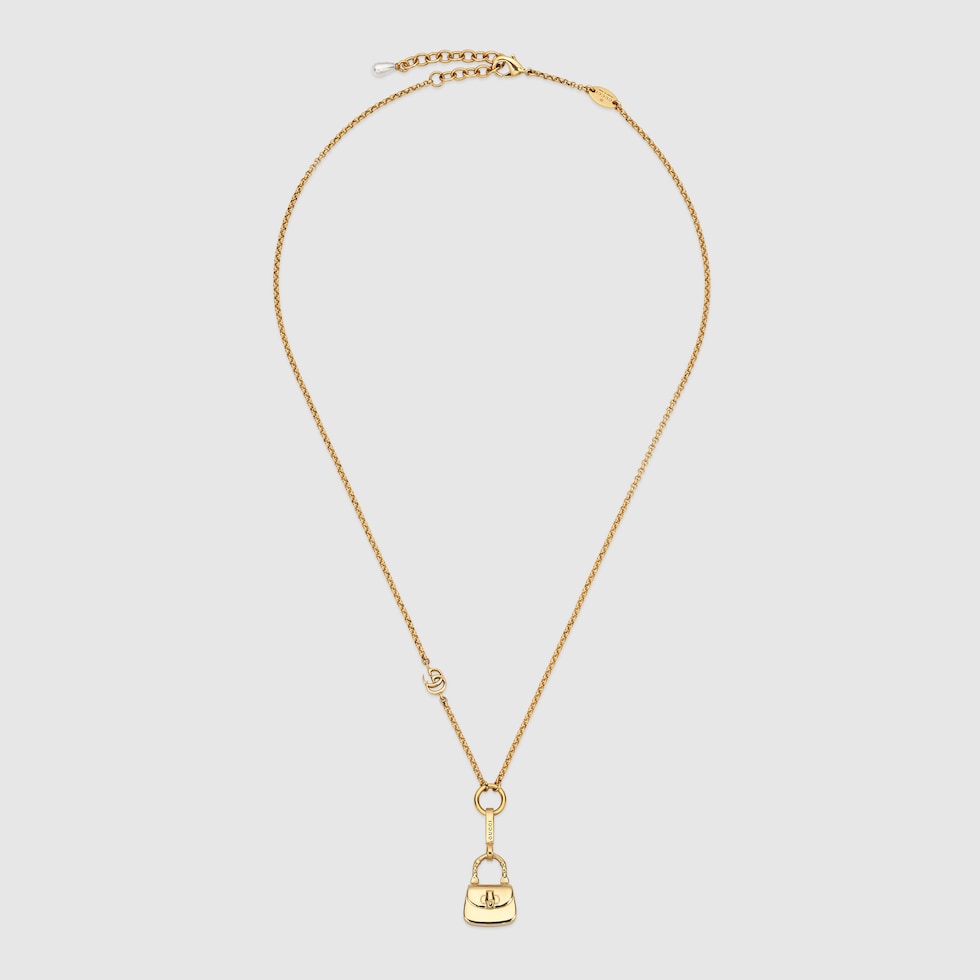 Chain necklace with bag pendant in yellow gold-toned metal | GUCCI® US