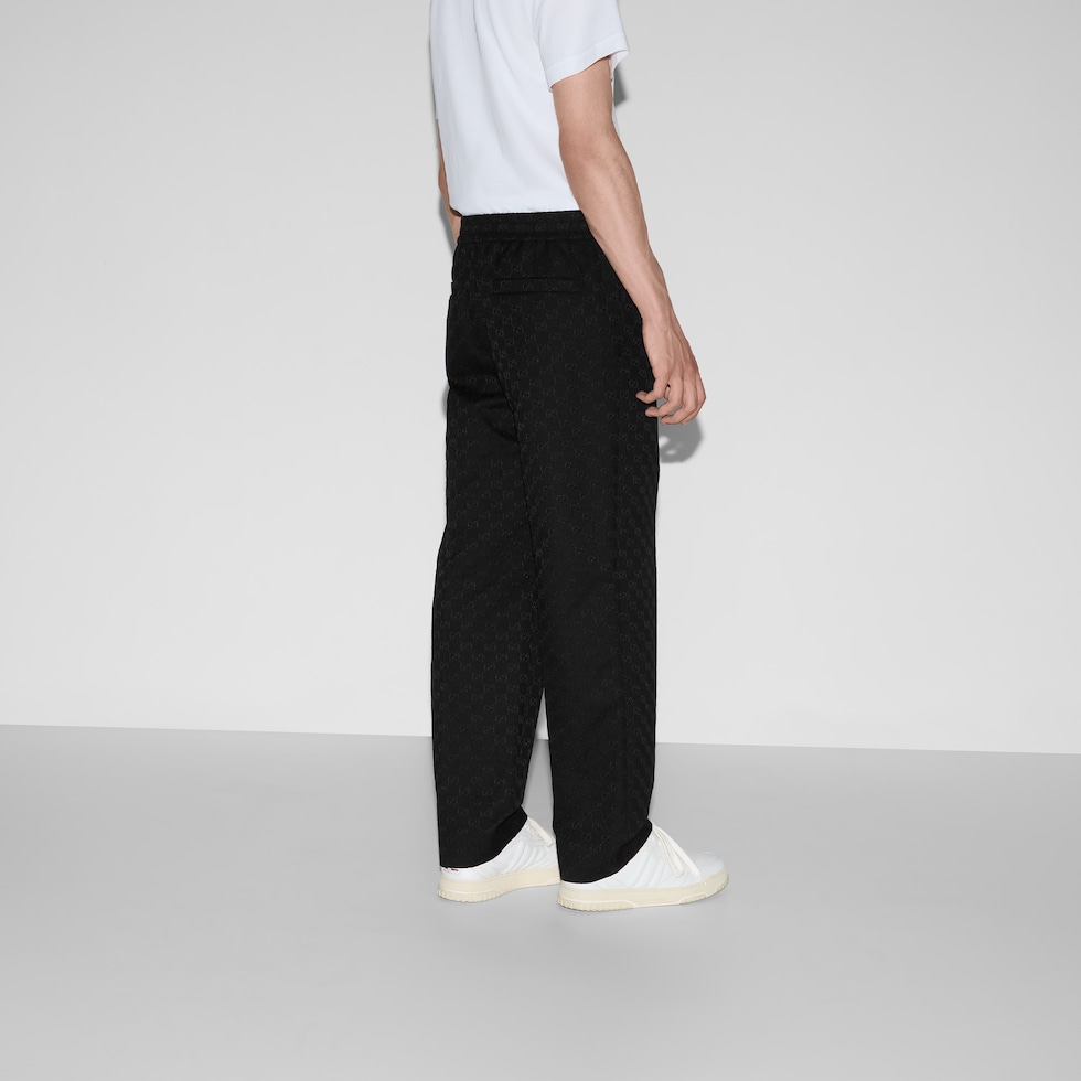 Pantalone in tessuto GG in nera | GUCCI® Italia