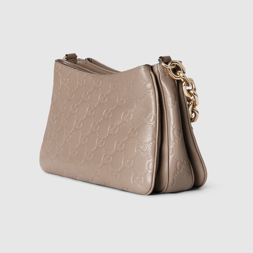 GG Emblem small shoulder bag in taupe leather | GUCCI® UK
