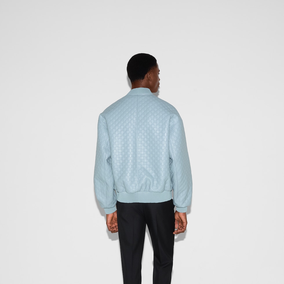 Embossed GG leather bomber jacket in light blue | GUCCI® PT