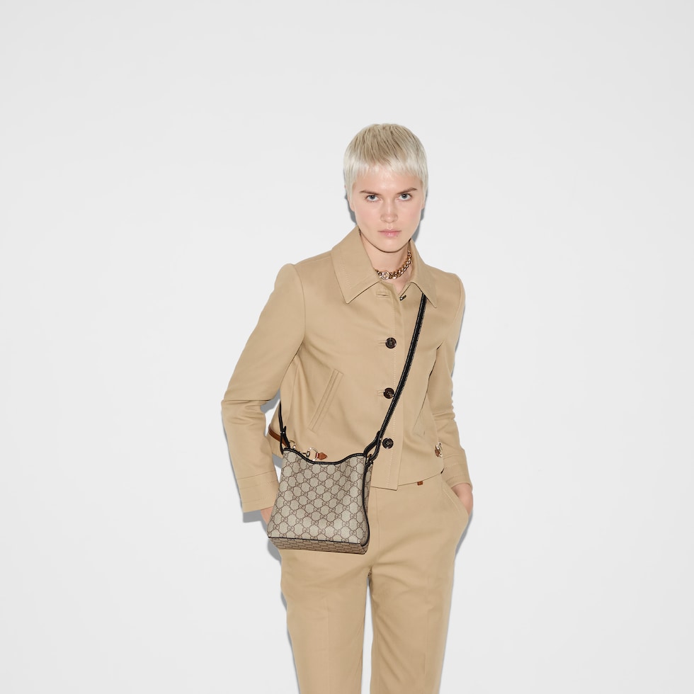 GG Emblem small bucket bag in beige and dark brown fabric | GUCCI® NL
