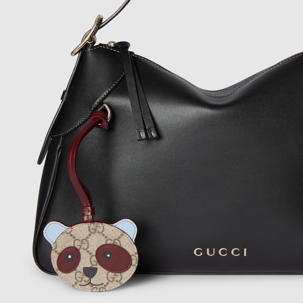 Panda-shaped bag charm in beige and dark brown canvas | GUCCI® NO