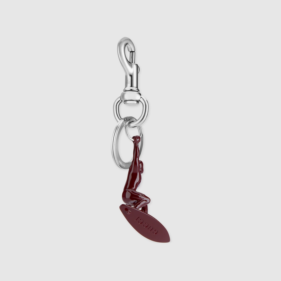 Engraved surfer keychain charm in rosso ancora red metal | GUCCI® UK