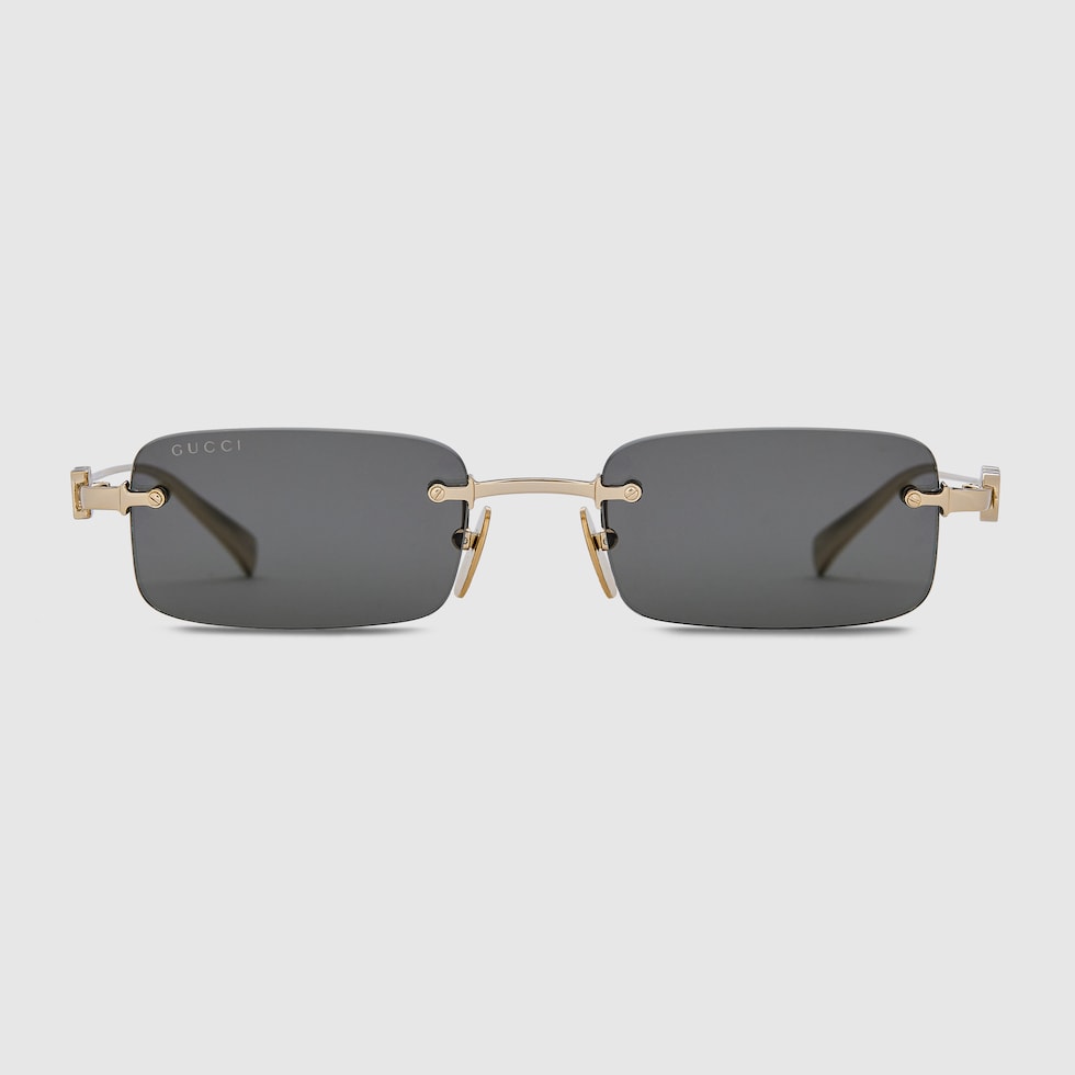 Gafas de sol con montura rectangular en tono dorado | GUCCI® ES