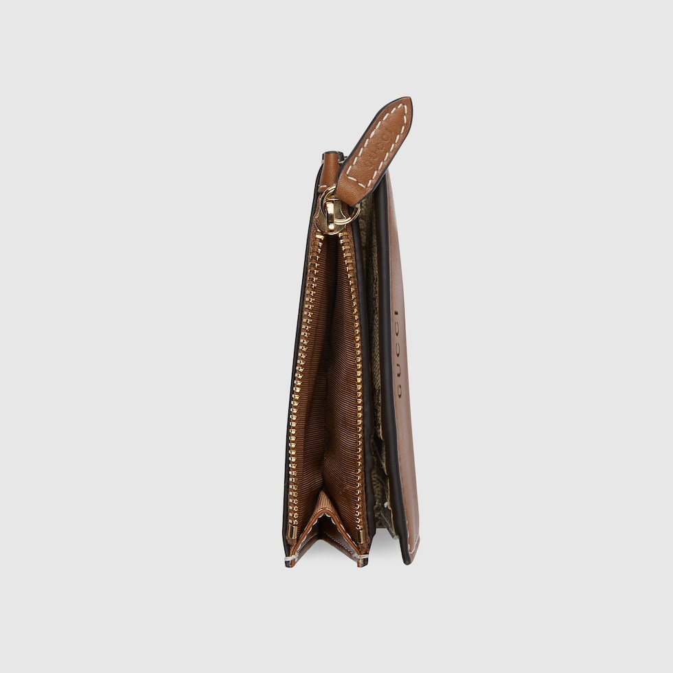 GG Emblem medium zip wallet in brown leather | GUCCI® FI
