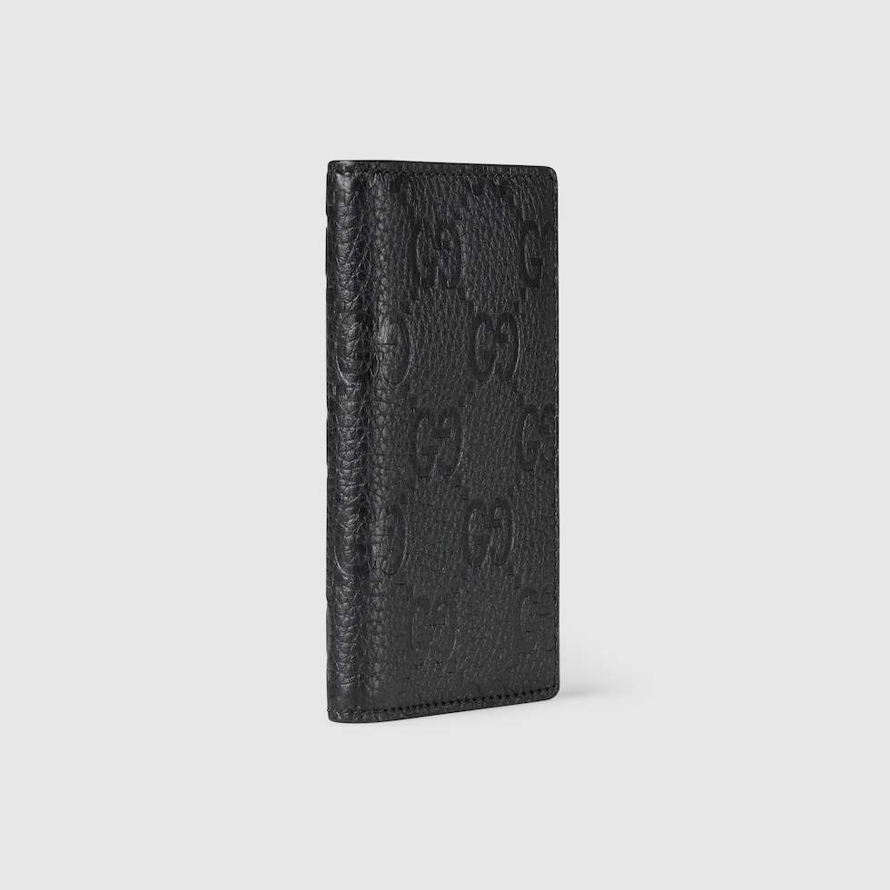 Gucci Imprint long card case in black GG leather | GUCCI® US