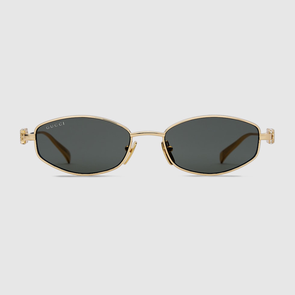 Oval frame sunglasses in yellow gold-toned | GUCCI® PL