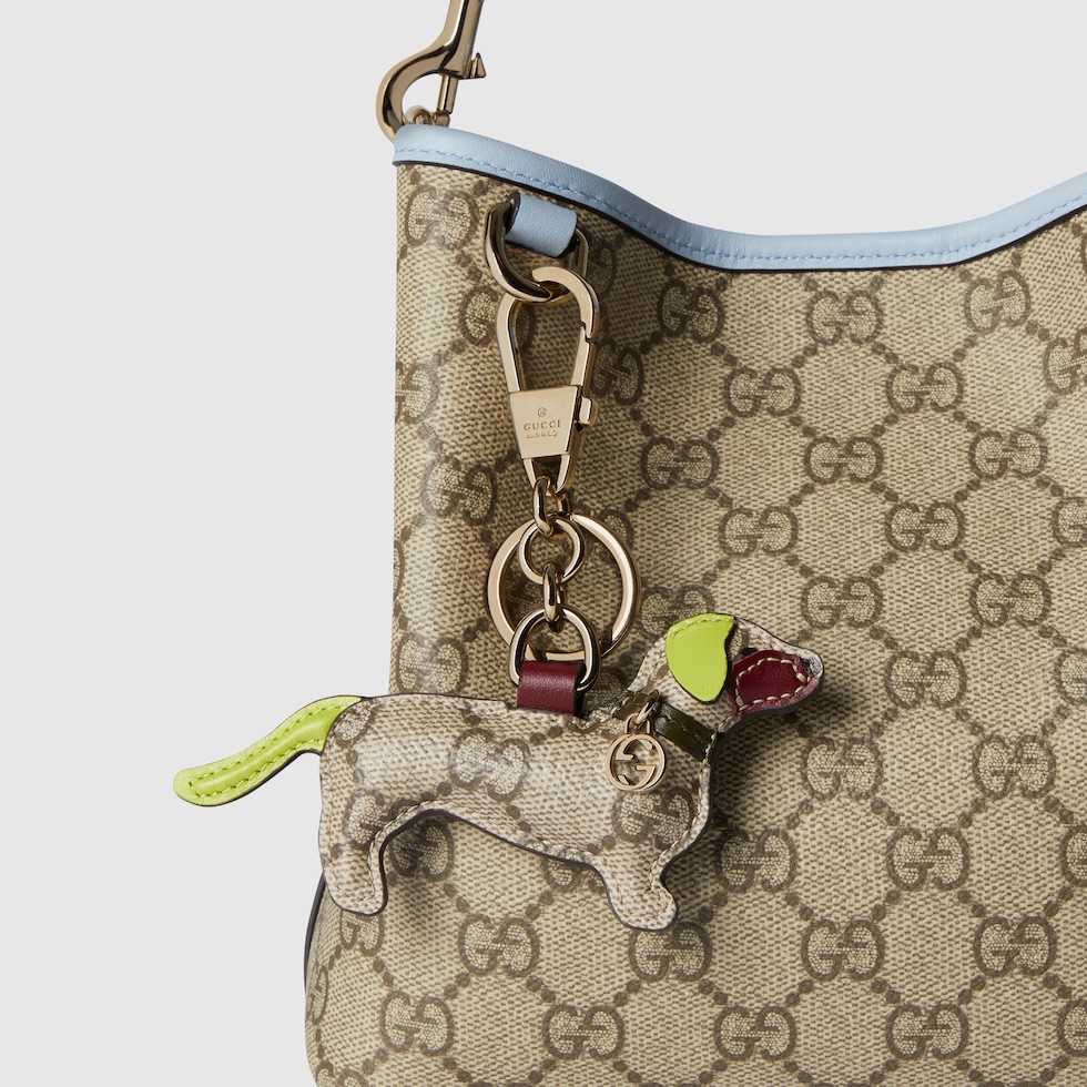 Dog-shaped bag charm in beige and brown GG fabric | GUCCI® UK