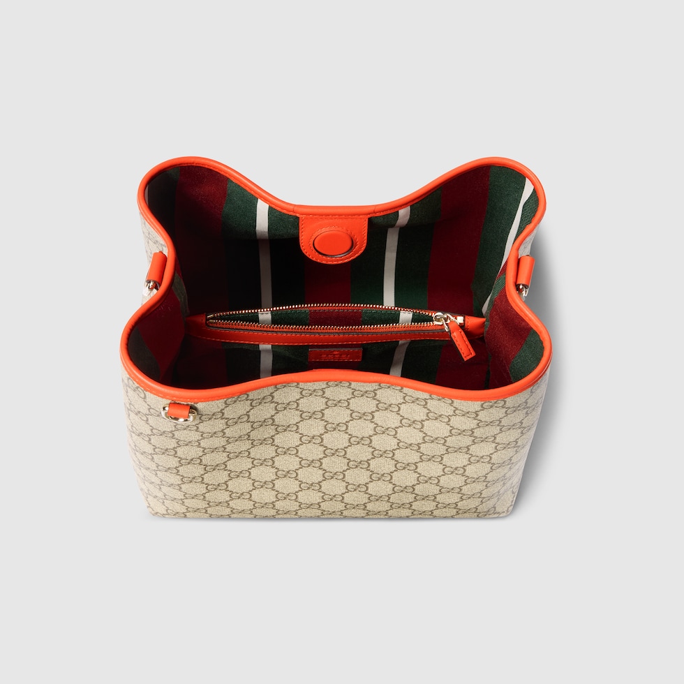 GG Emblem medium bucket bag in beige and brown GG fabric | GUCCI® UK