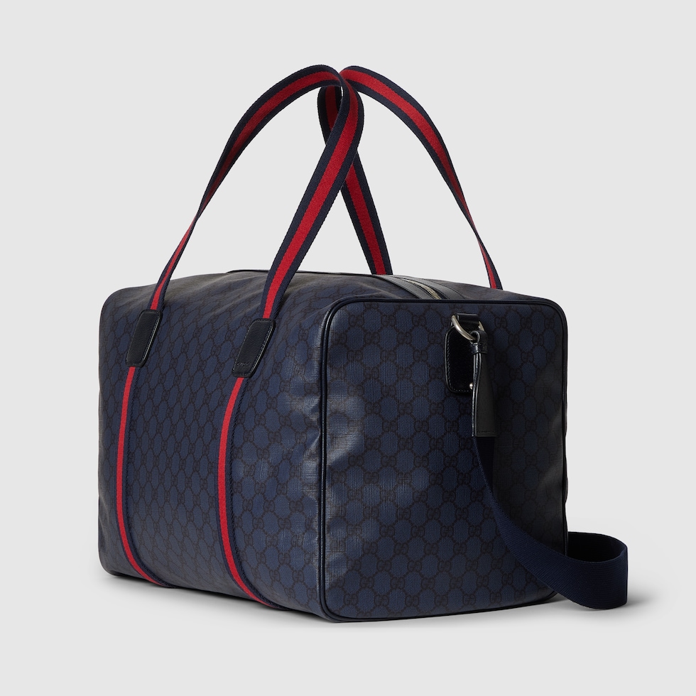 Medium duffle bag with Web in dark blue GG Supreme | GUCCI® AE