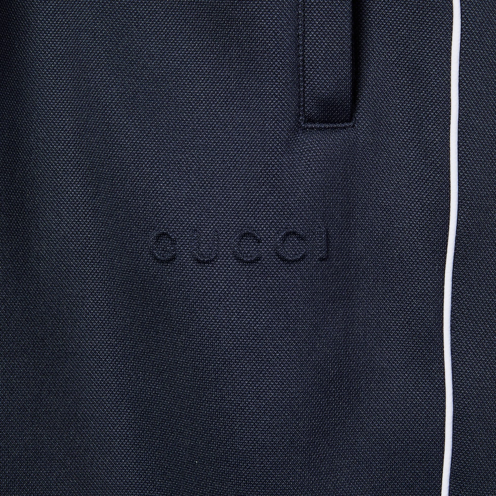 Technical jersey pant with embossed logo in navy | GUCCI® US