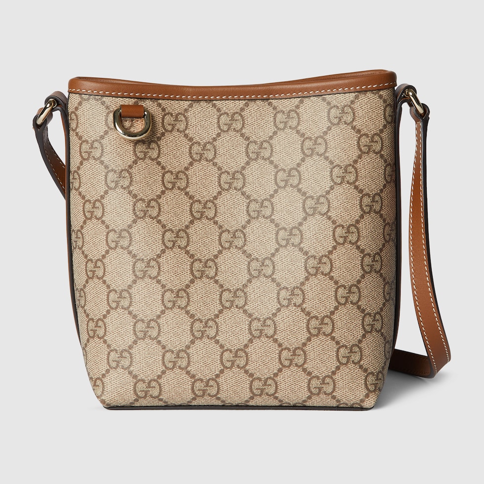 Bolsa bucket miniatura GG Emblem en tejido beige y café oscuro | GUCCI® MX