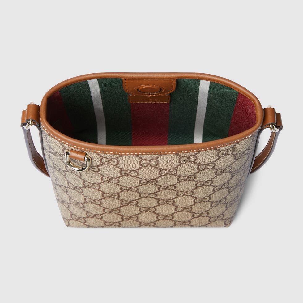 Bolsa bucket miniatura GG Emblem en tejido beige y café oscuro | GUCCI® MX