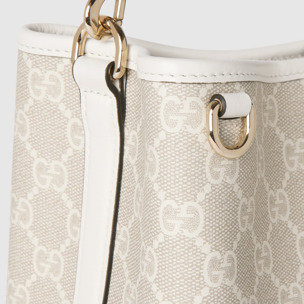 GG Emblem small bucket bag in beige and white GG fabric | GUCCI® US