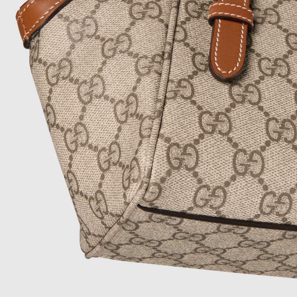 GG Emblem small top handle bag in beige and brown GG fabric | GUCCI® NL