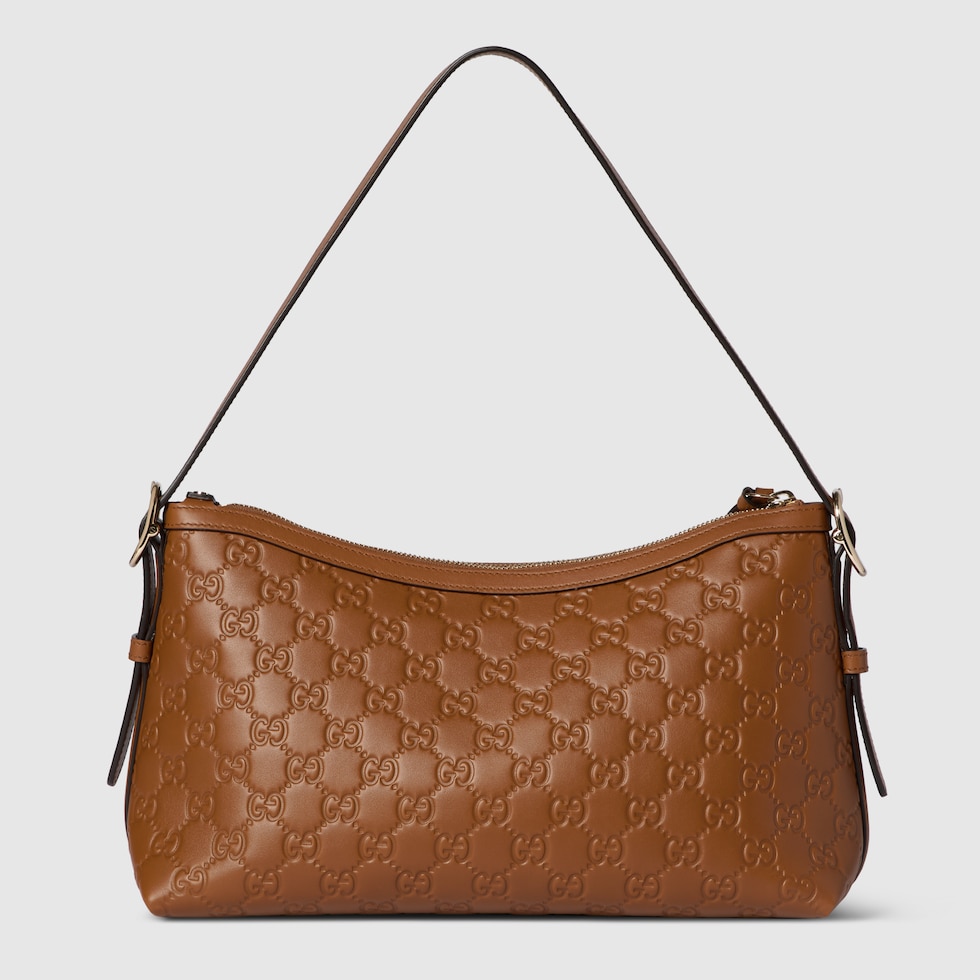 GG Emblem medium shoulder bag in brown GG leather | GUCCI® UK