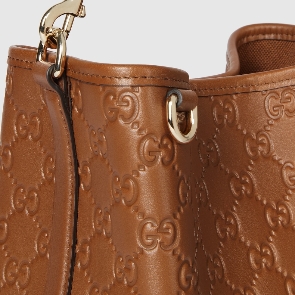 GG Emblem small bucket bag in brown GG leather | GUCCI® SG