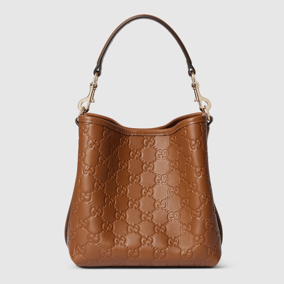 GG Emblem small bucket bag in brown GG leather | GUCCI® SG
