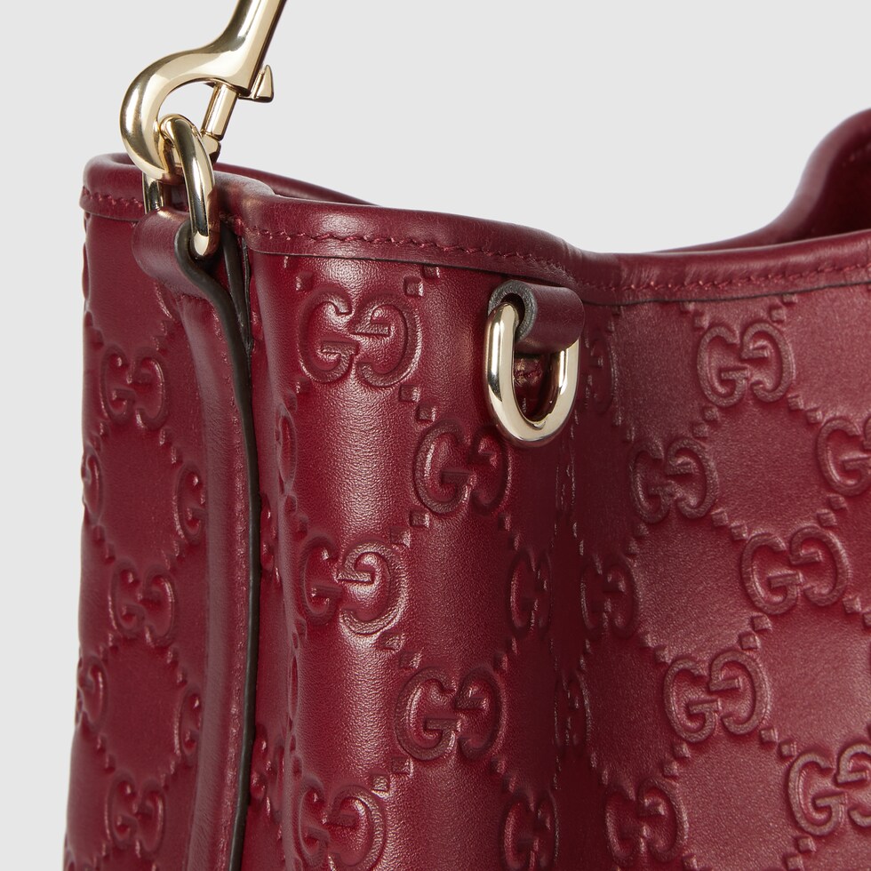 GG Emblem small bucket bag in Rosso Ancora red GG leather | GUCCI® AU