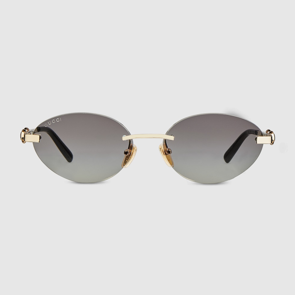 Gafas de sol ovaladas sin montura en tono dorado | GUCCI® ES