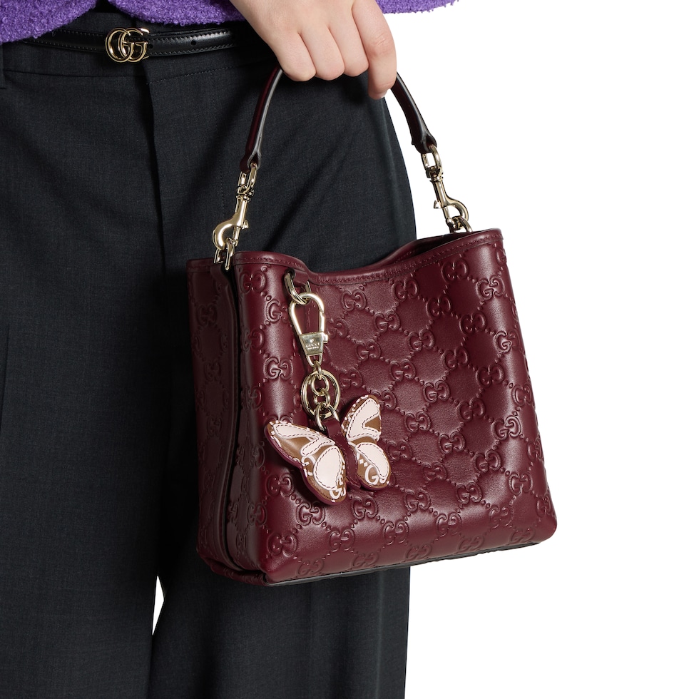 Butterfly-shaped keychain in brown and pink GG leather | GUCCI® IE