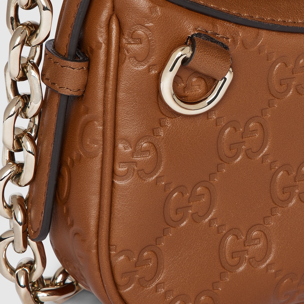 GG Emblem mini shoulder bag in brown GG leather | GUCCI® SG
