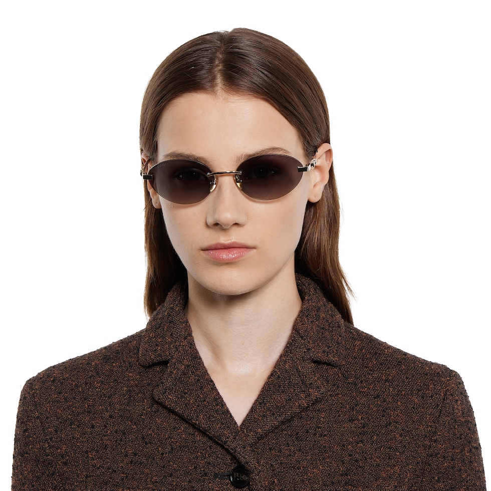 Gafas de sol ovaladas sin montura en tono dorado | GUCCI® ES