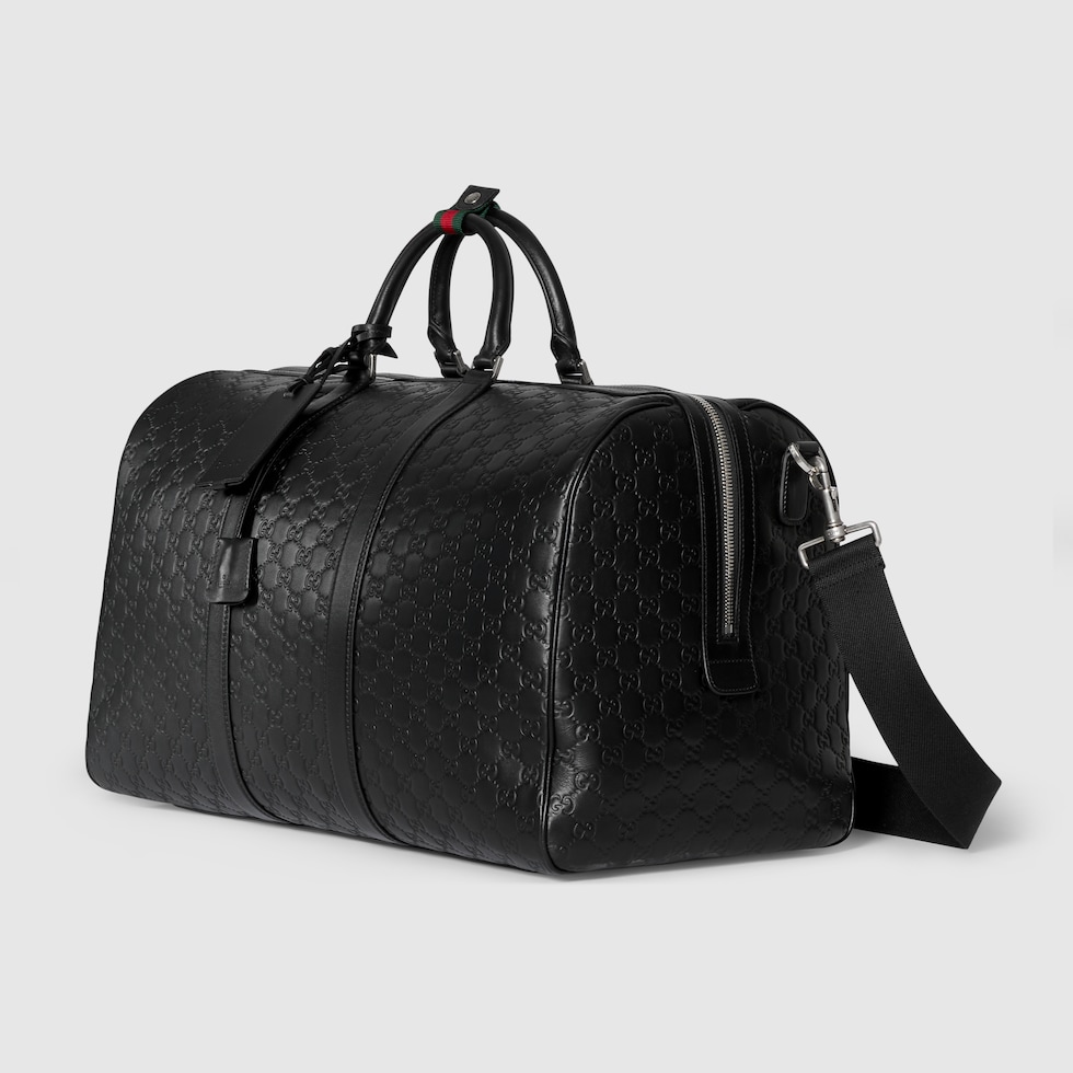 GG Emblem large duffle bag in black GG leather | GUCCI® US
