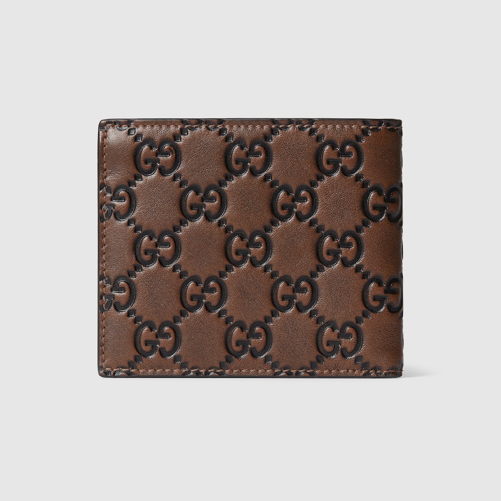 GG Emblem bi-fold wallet in brown and black GG leather | GUCCI® RO