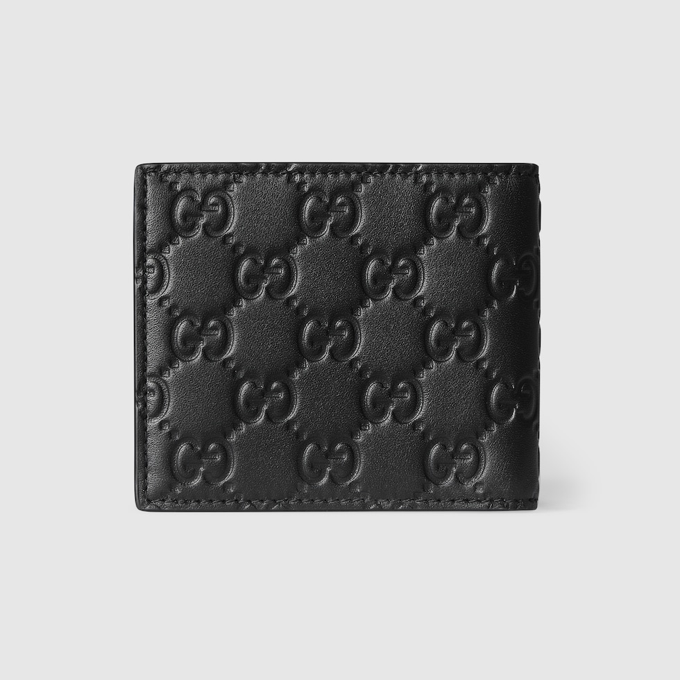 GG Emblem bi-fold wallet in black GG leather | GUCCI® CH