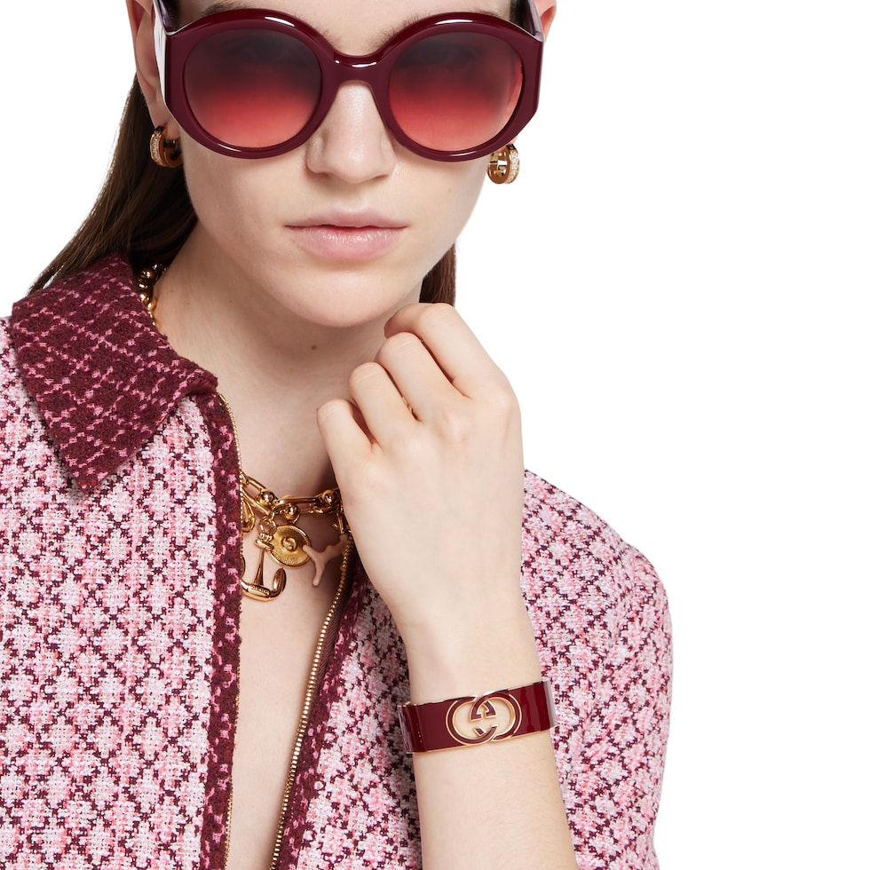 Gucci Interlocking enamel cuff bracelet in yellow gold-toned brass ...