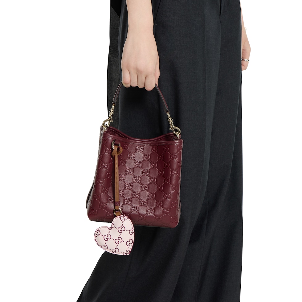 Heart-shaped bag charm in pink embossed GG leather | GUCCI® US
