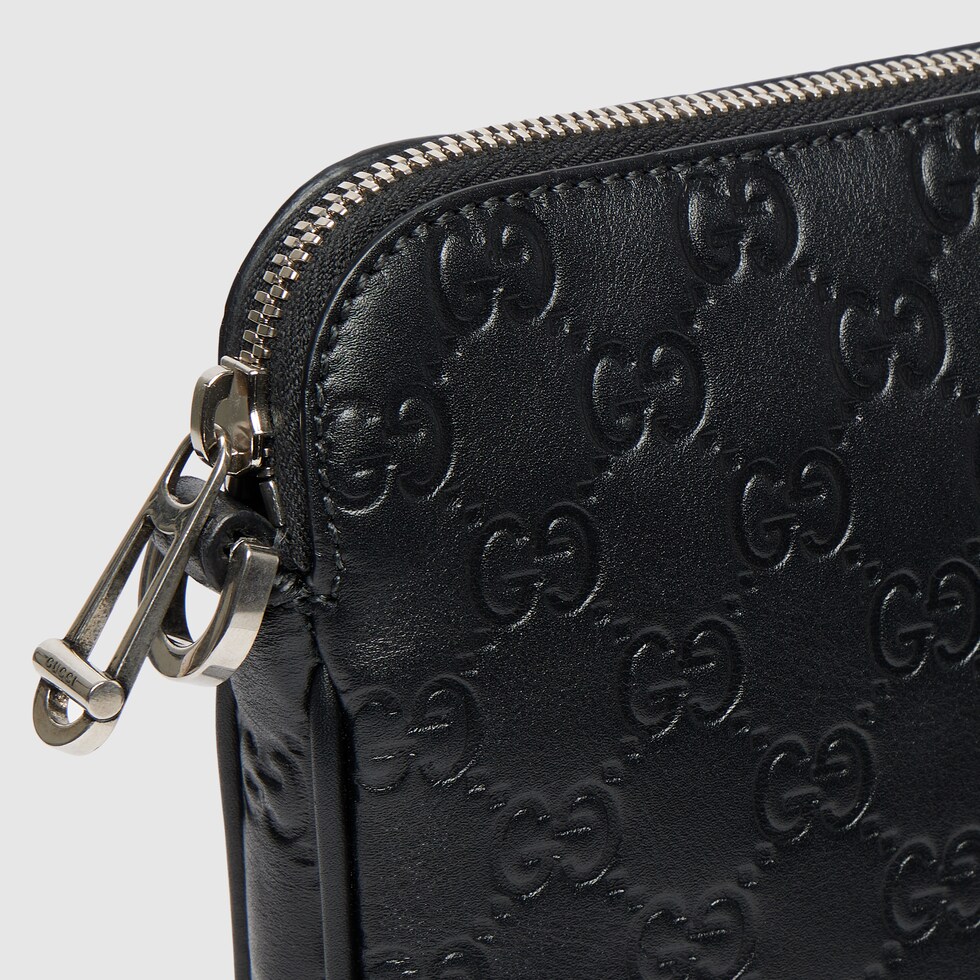 GG Emblem medium crossbody bag in black GG leather | GUCCI® US
