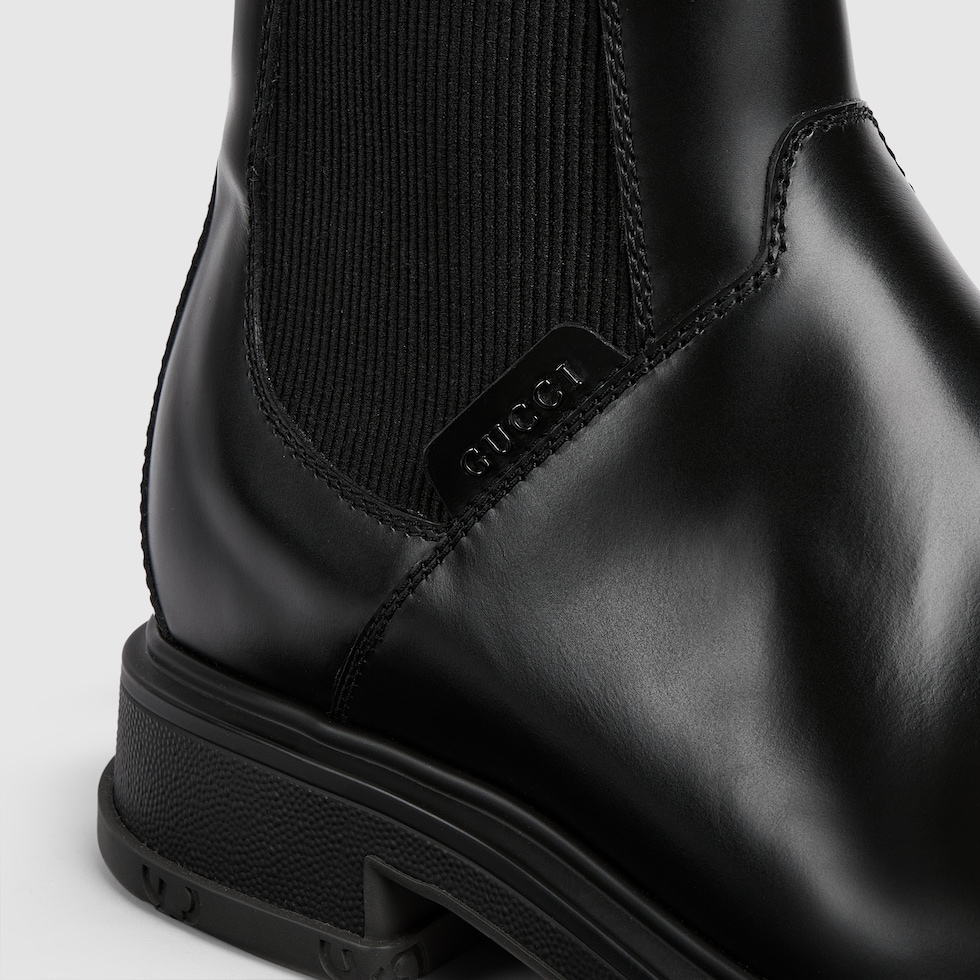 Men's ankle boot with tonal logo in black leather | GUCCI® TR