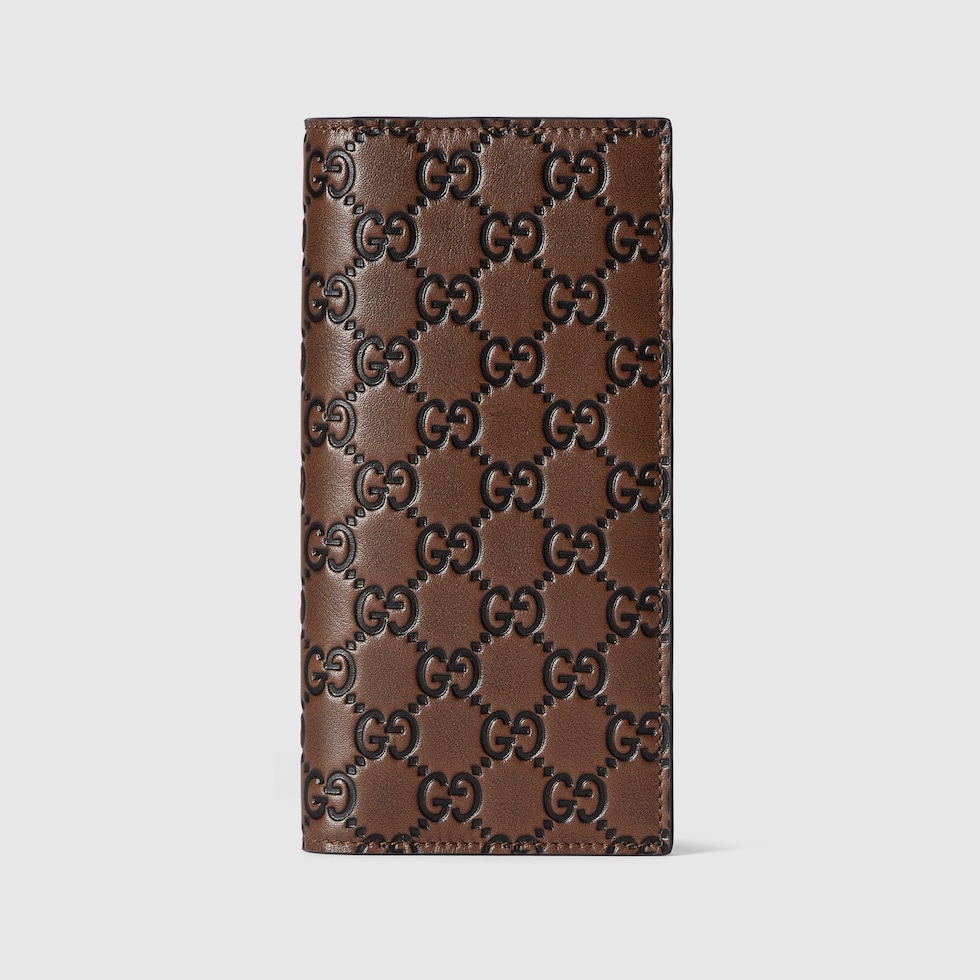 GG Emblem long wallet in brown and black GG leather | GUCCI® SG