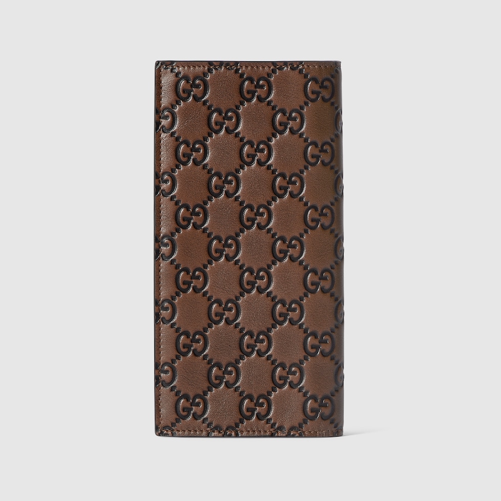 GG Emblem long wallet in brown and black GG leather | GUCCI® AU